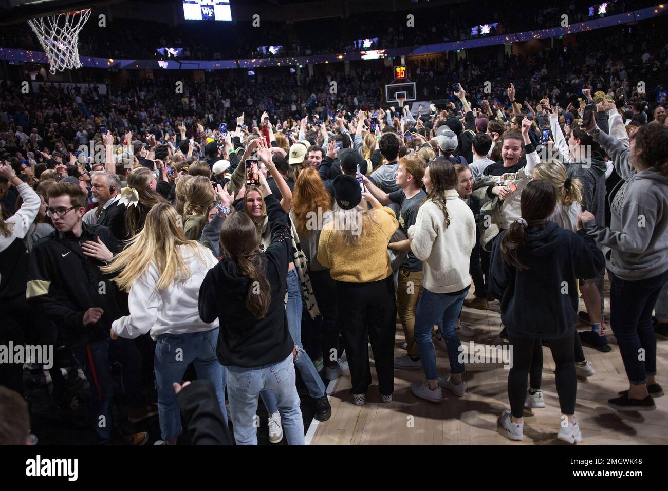 Wake Forest fans celebrate their double overtime win against Duke in a ...