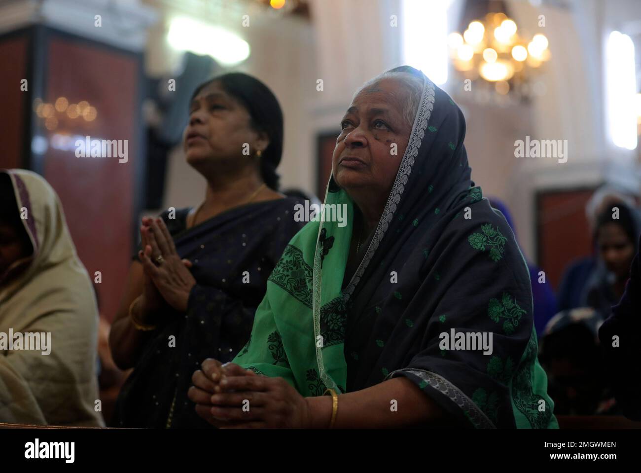 Indian Catholics offer prayers during an Ash Wednesday service at the ...