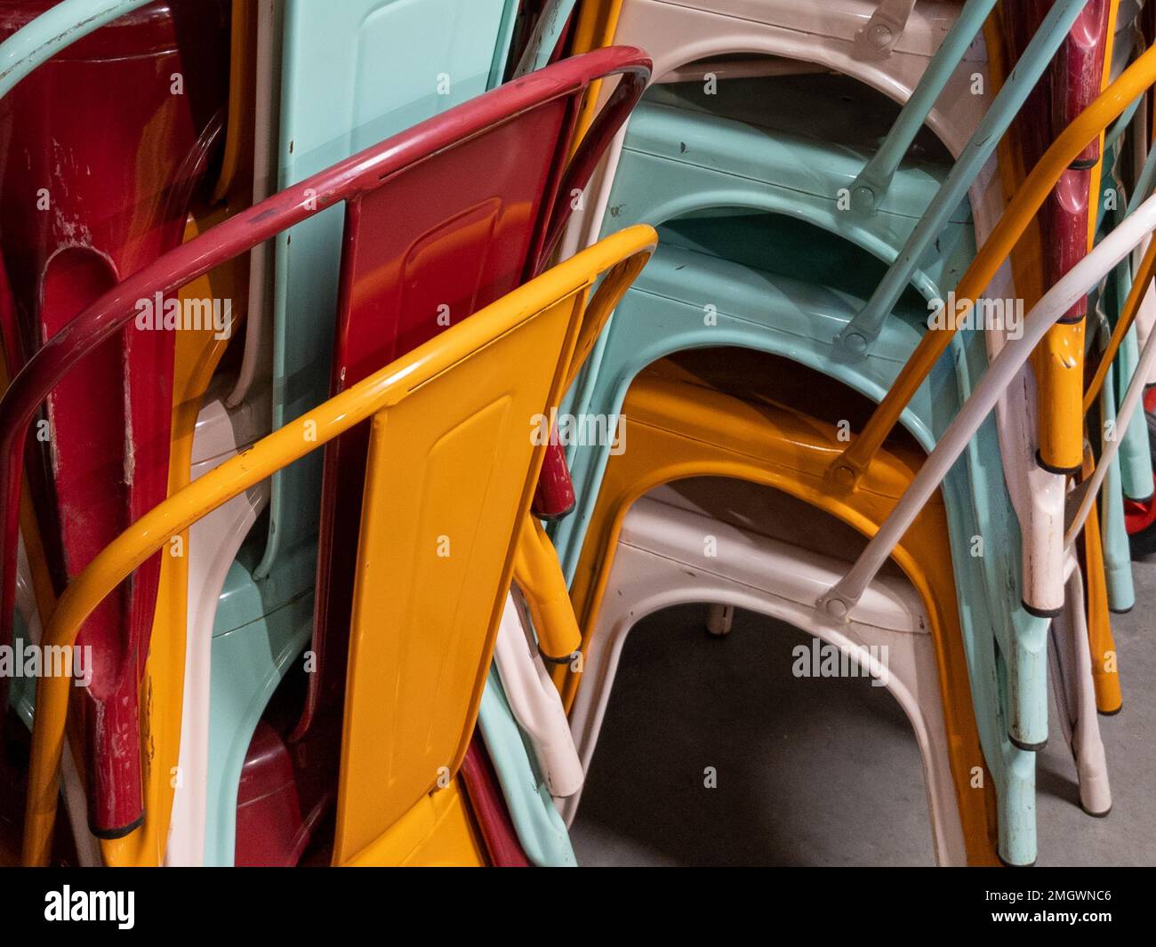 iron stack of multicolored industrial chairs for loft style in ...