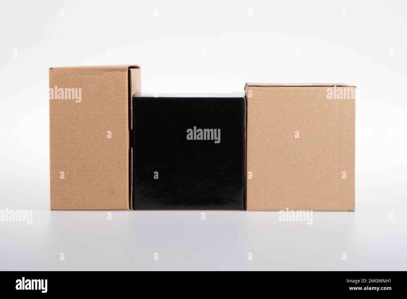 Cardboard Boxes three package brown black white background Stock Photo ...