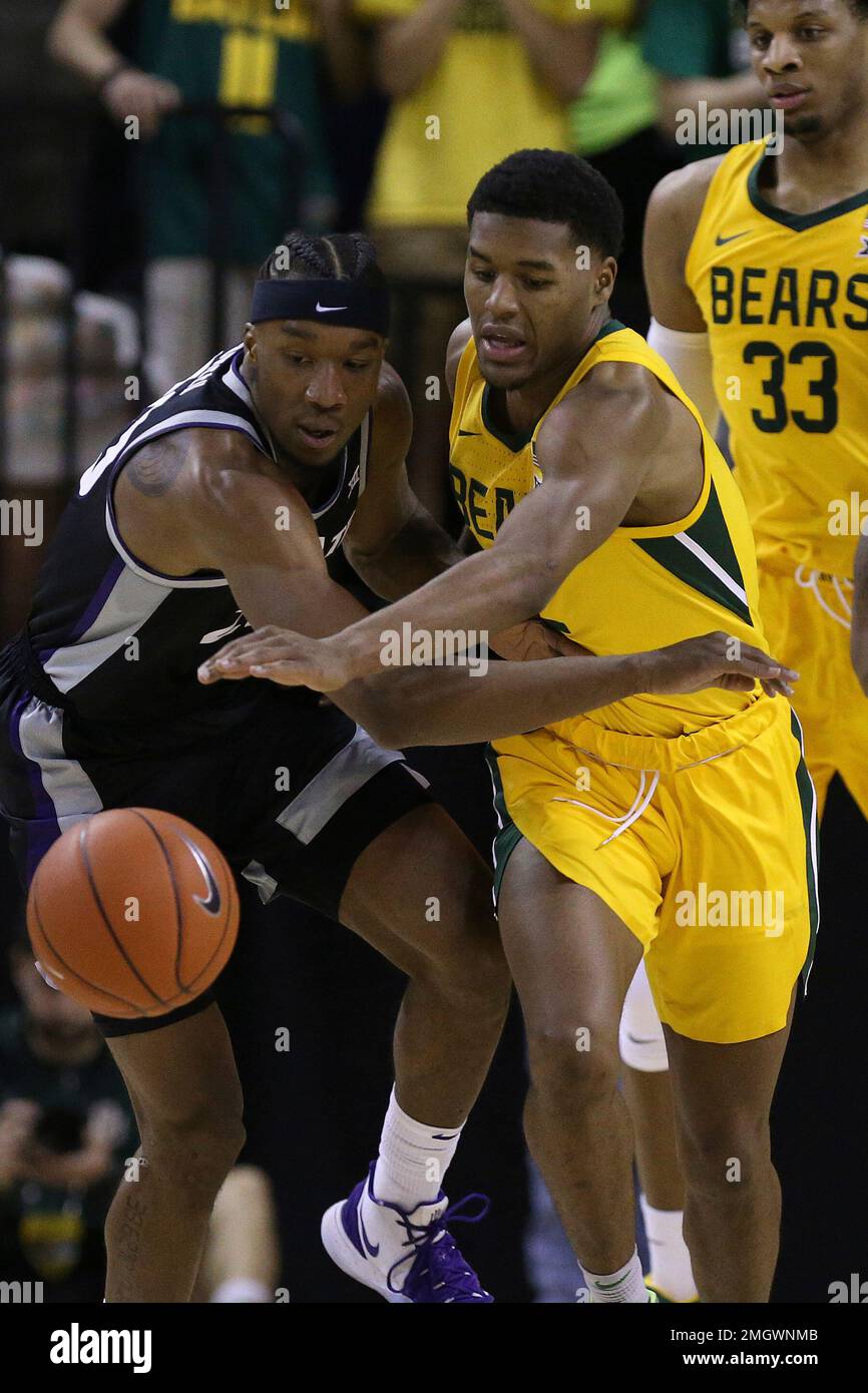 Kansas State forward Xavier Sneed (20) and Baylor guard Jared Butler ...