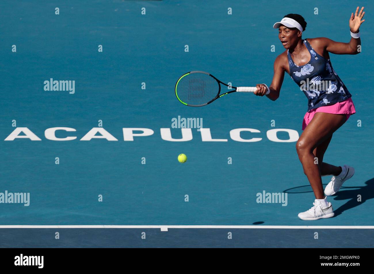 Venus Williams of the U.S. returns a ball in her Round 1 match against ...