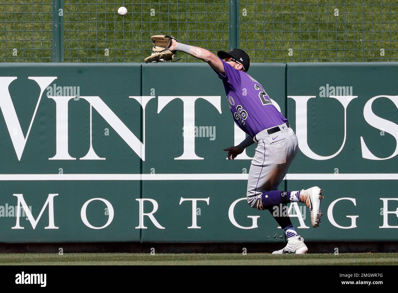Colorado Rockies' David Dahl catches a line out during the second ...