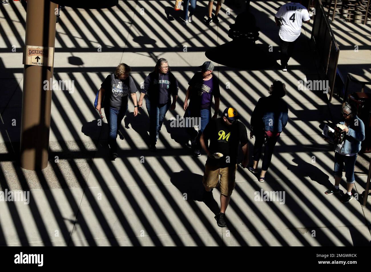Fans for the Seattle Mariners and the Milwaukee Brewers walk in the ...
