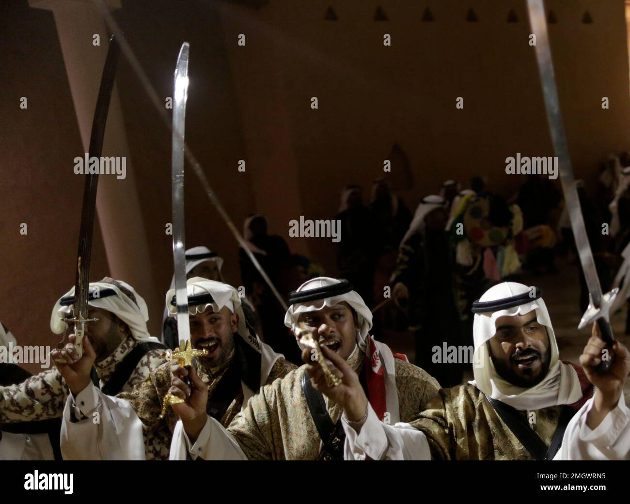 Saudi dancers perform with swords during the traditional dancing best ...