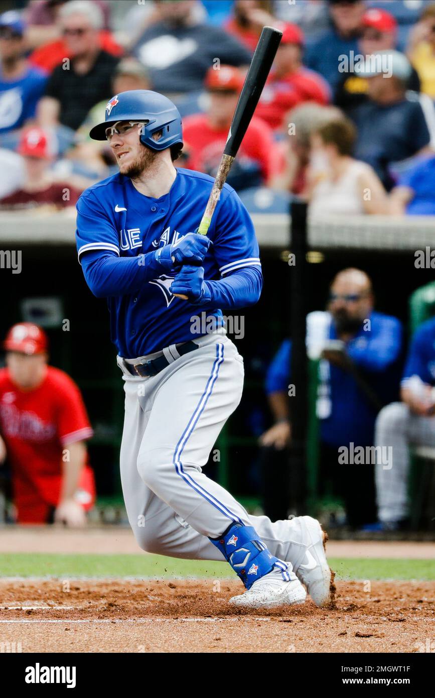 Toronto Blue Jays' Danny Jansen follows through on a single during the ...