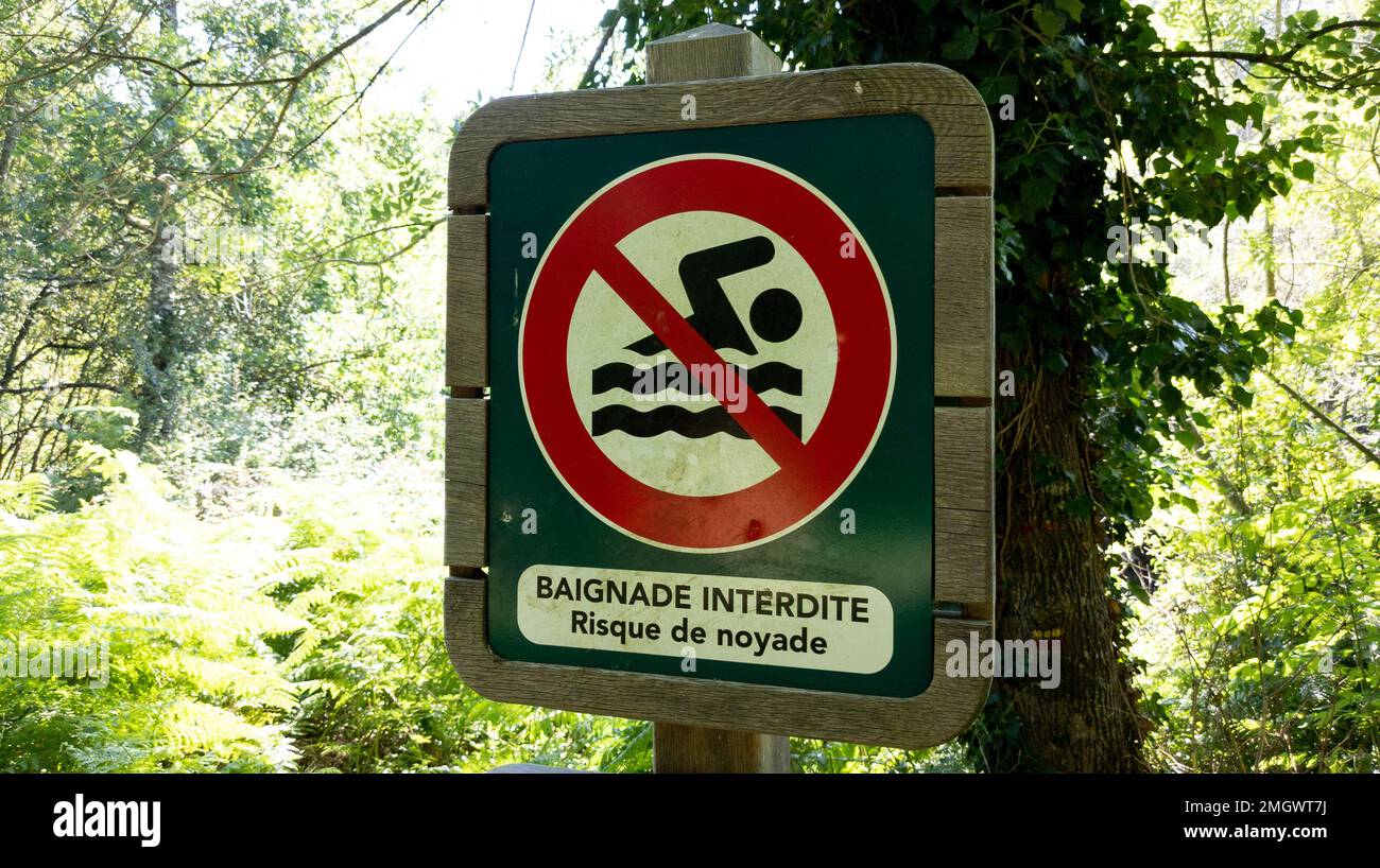 No bathing sign prohibited and risk of drowning text in french means ...