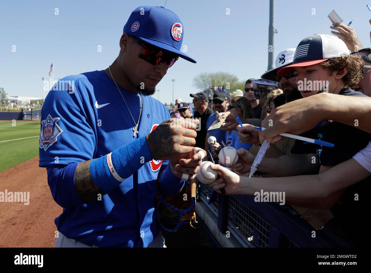 Chicago Cubs' Javier Baez signs autographs before a spring training ...