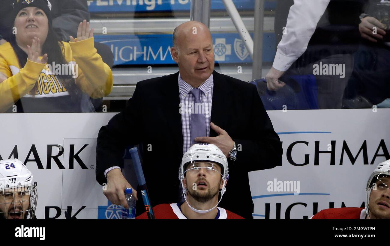 Montreal Canadiens head coach Claude Julien stands behind his bench ...