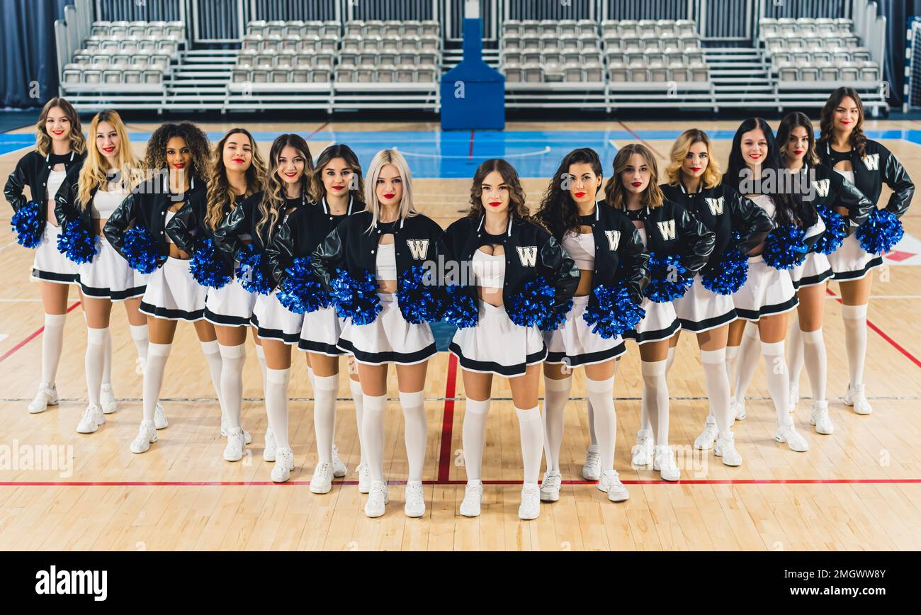 Top view of cheerleaders wearing black jumpers and standing in v ...