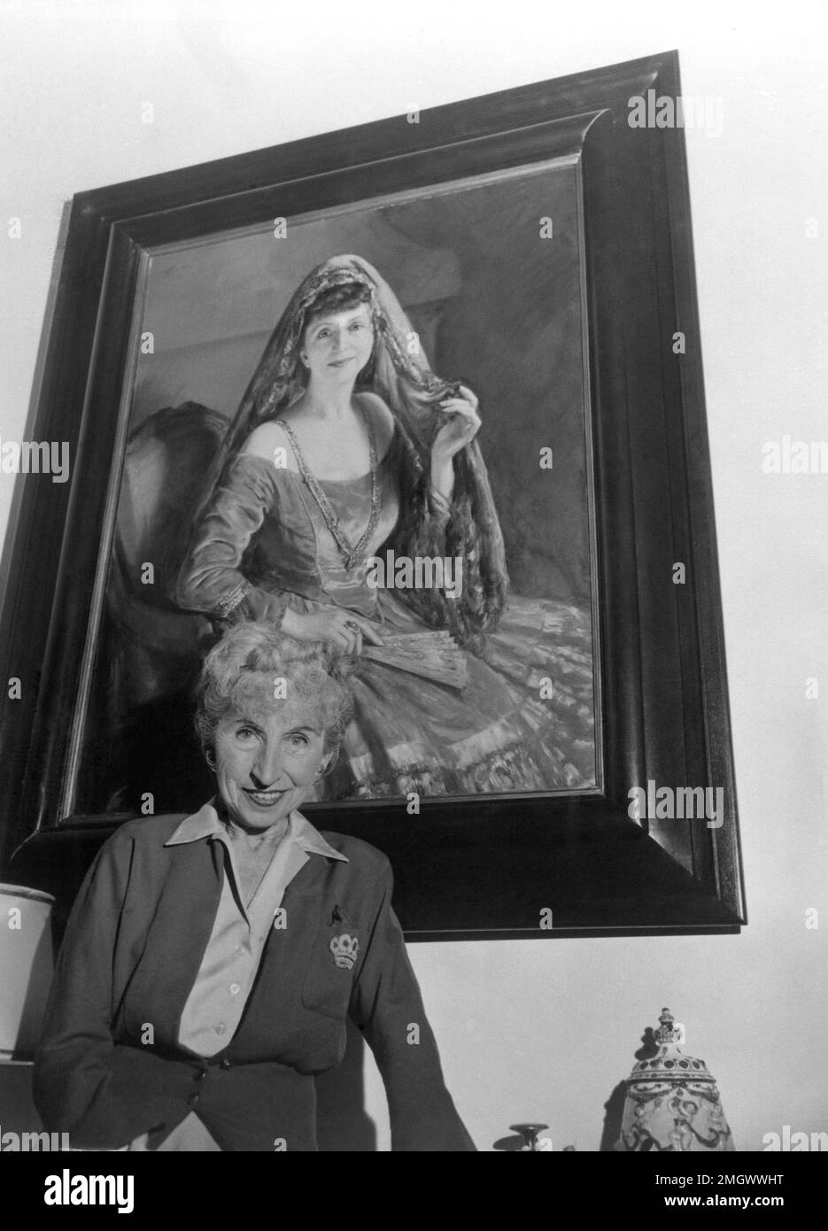 Opera singer Amelita Galli-Curci beside a portrait of herself by ...