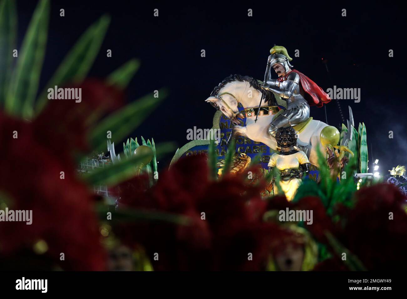 Performers from the Mocidade samba school parade on a float during ...