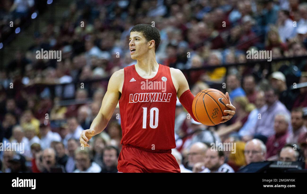 Louisville guard Samuell Williamson (10) brings the ball up court ...