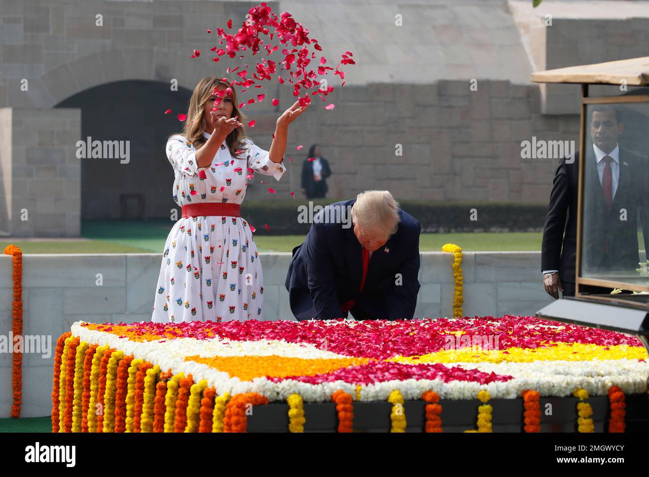 U.S. President Donald Trump and first lady Melania Trump offer their ...