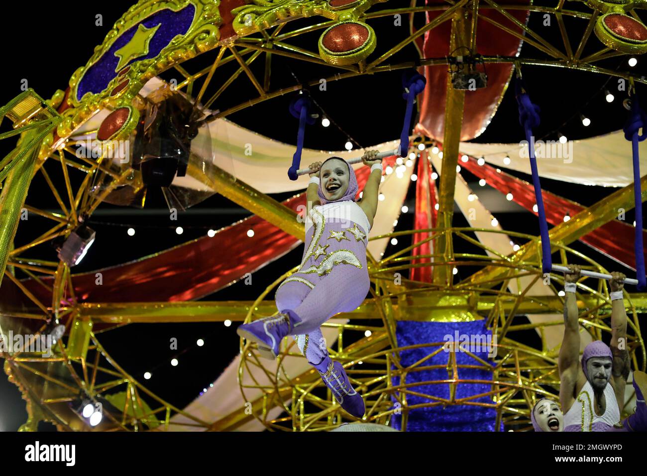 Performer from the Salgueiro samba school parades on a float during ...