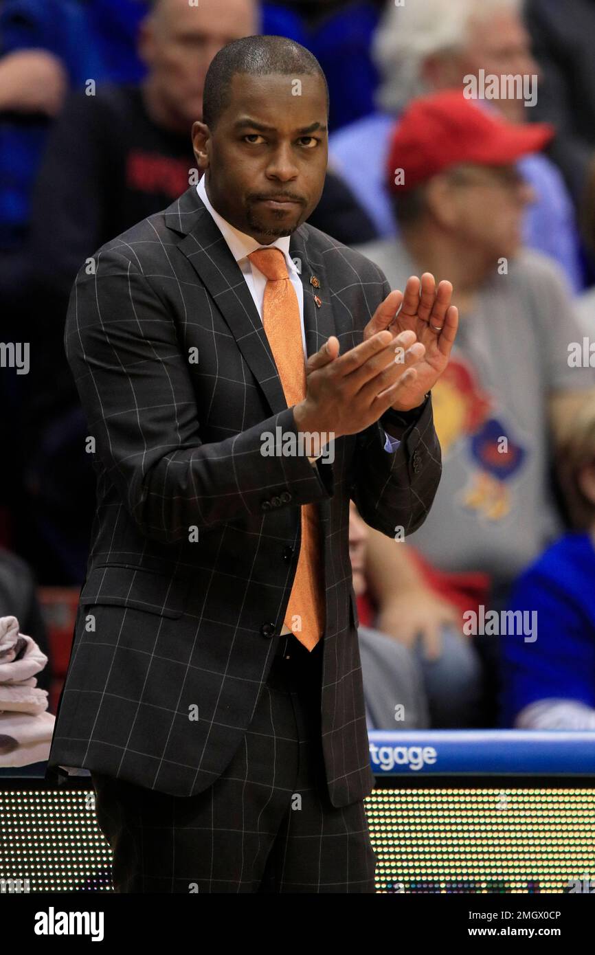 Oklahoma State head coach Mike Boynton applauds his team during the first half of an NCAA ...