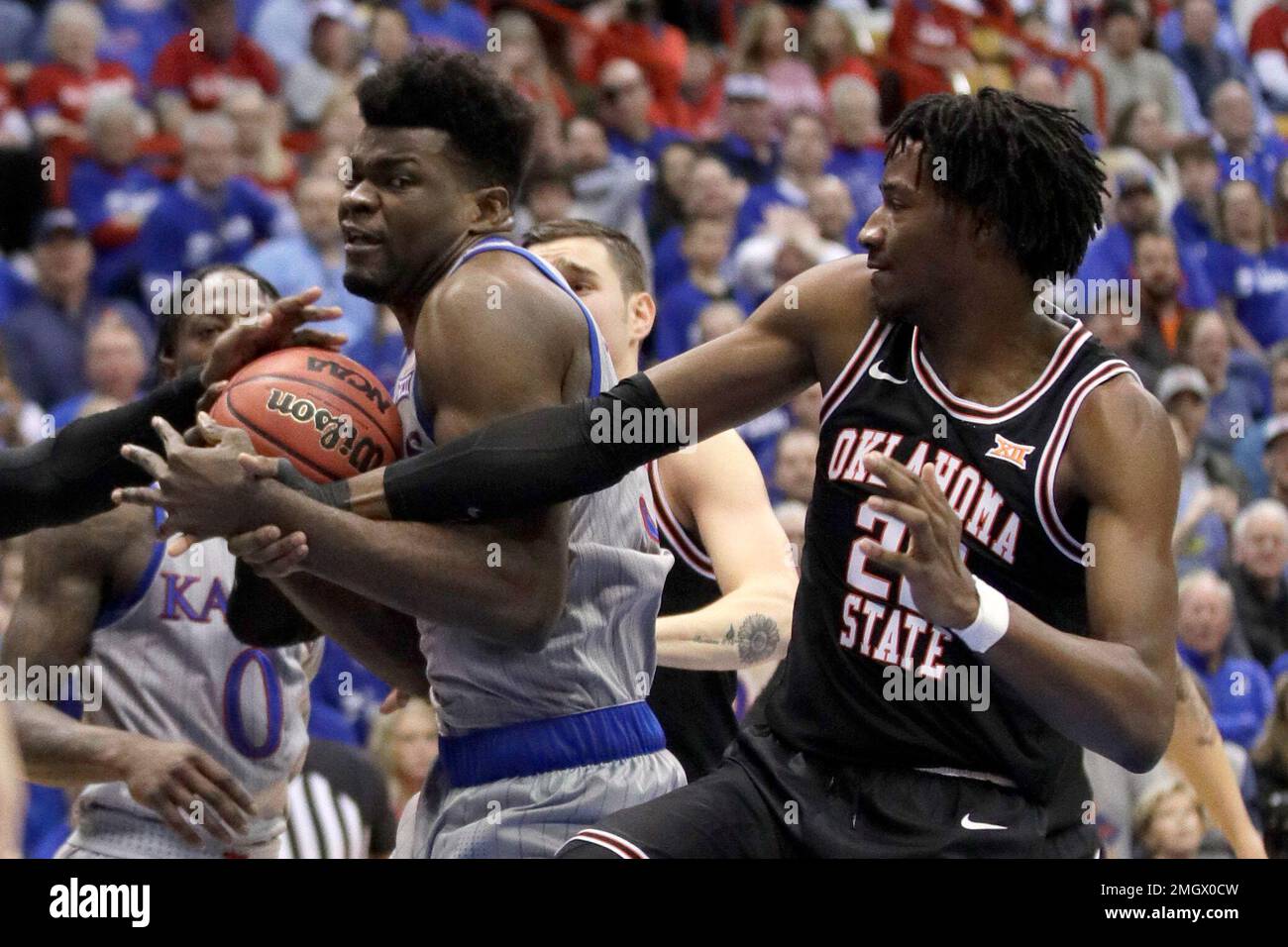 Kansas center Udoka Azubuike, left, rebounds against Oklahoma State ...