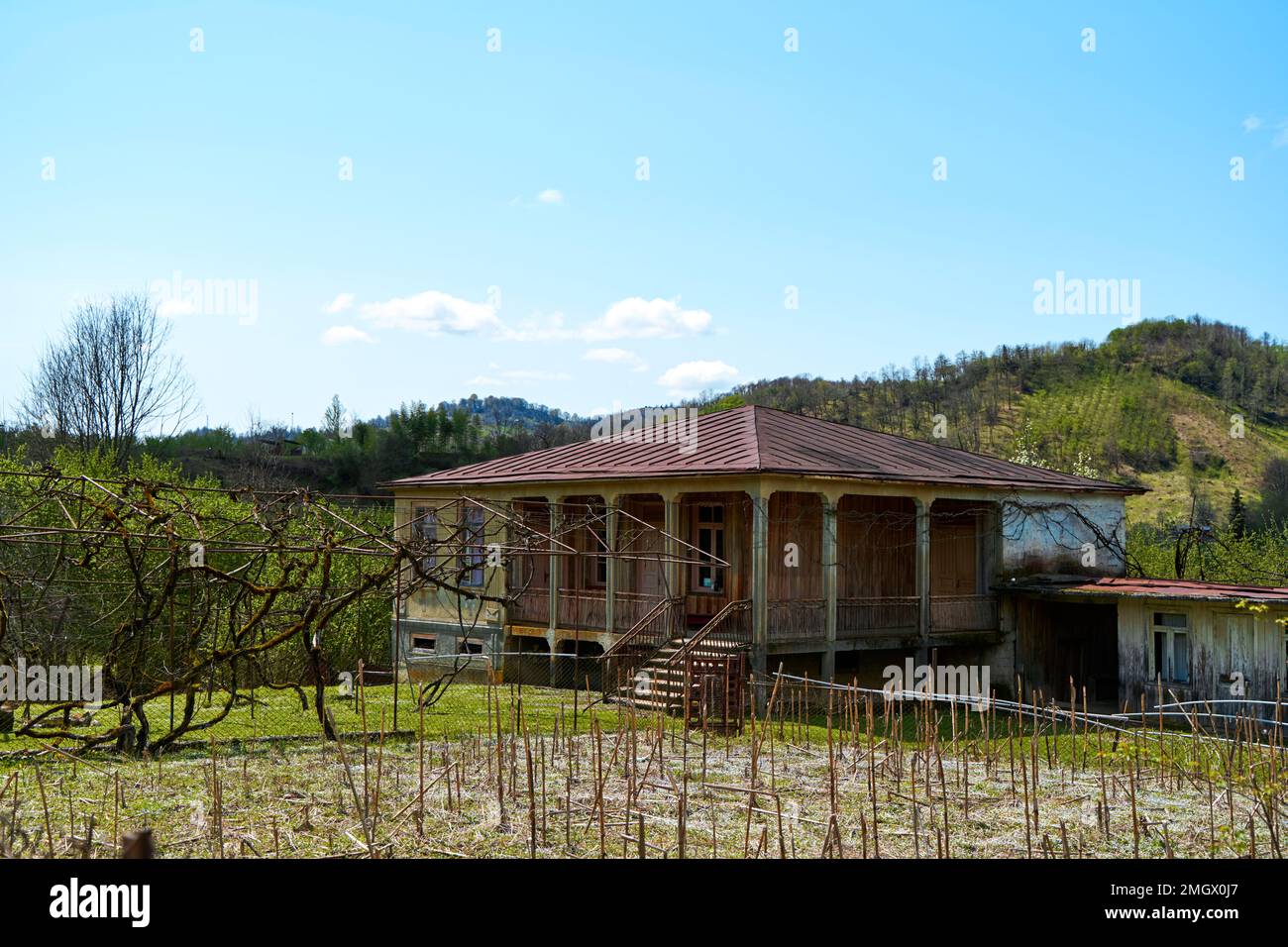 Detached old two-story wooden house. Traditional Georgian house in the ...