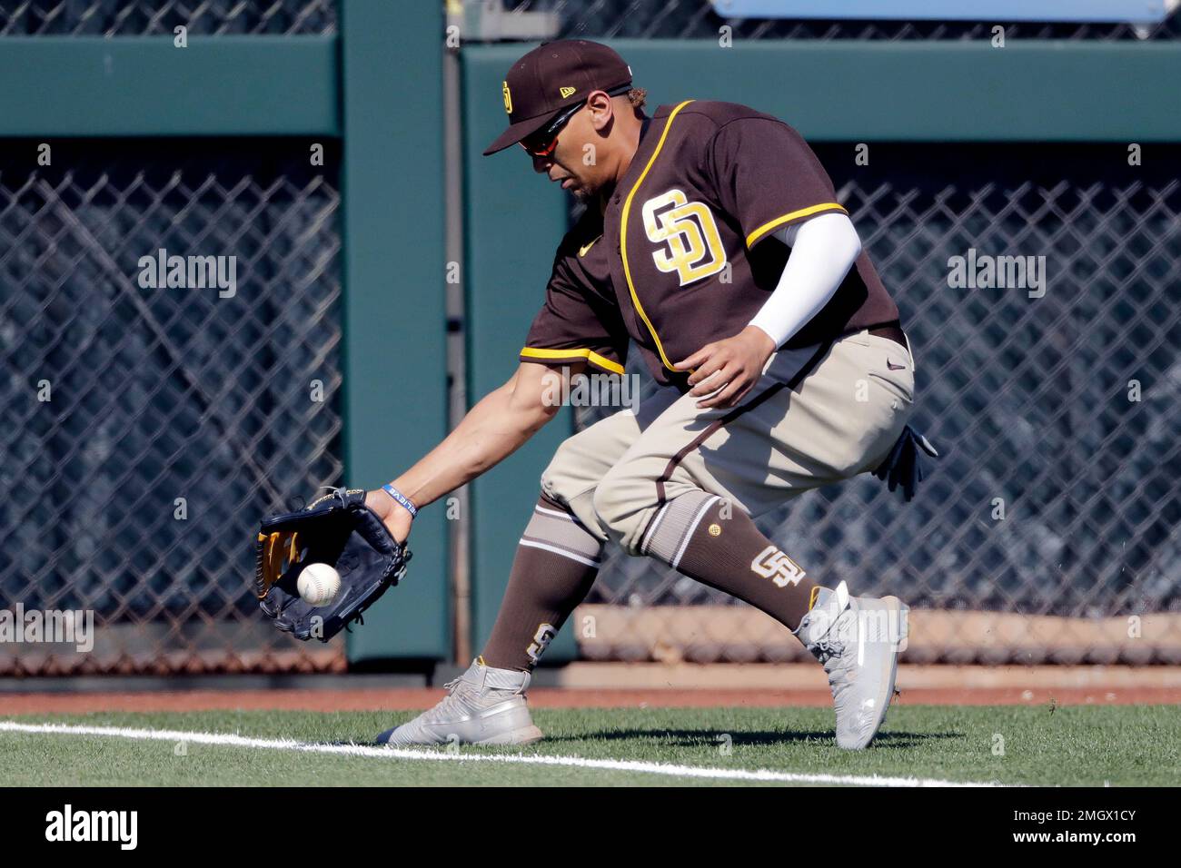San Diego Padres left fielder Josh Naylor fields an RBI double hit by ...
