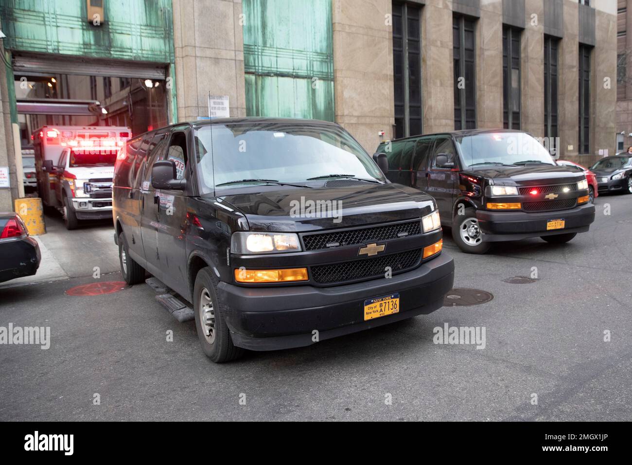 An ambulance carrying Harvey Weinstein is escorted from a Manhattan ...