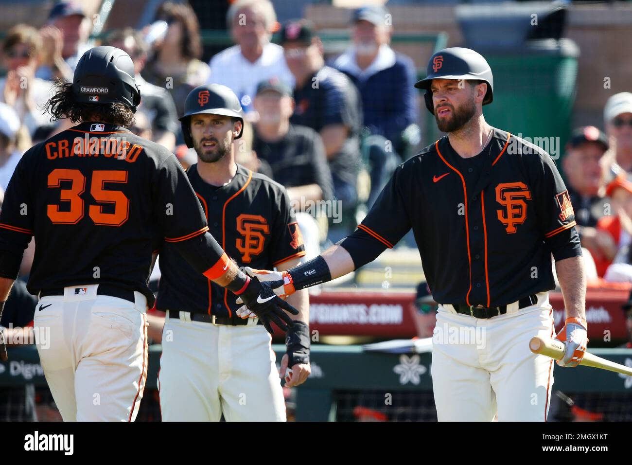 San Francisco Giants' Brandon Crawford (35) and Steven Duggar, center ...