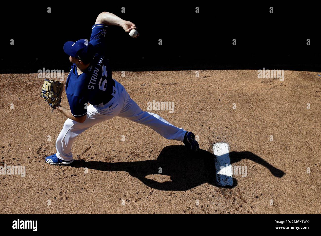 Los Angeles Dodgers starting pitcher Ross Stripling warms up in the ...