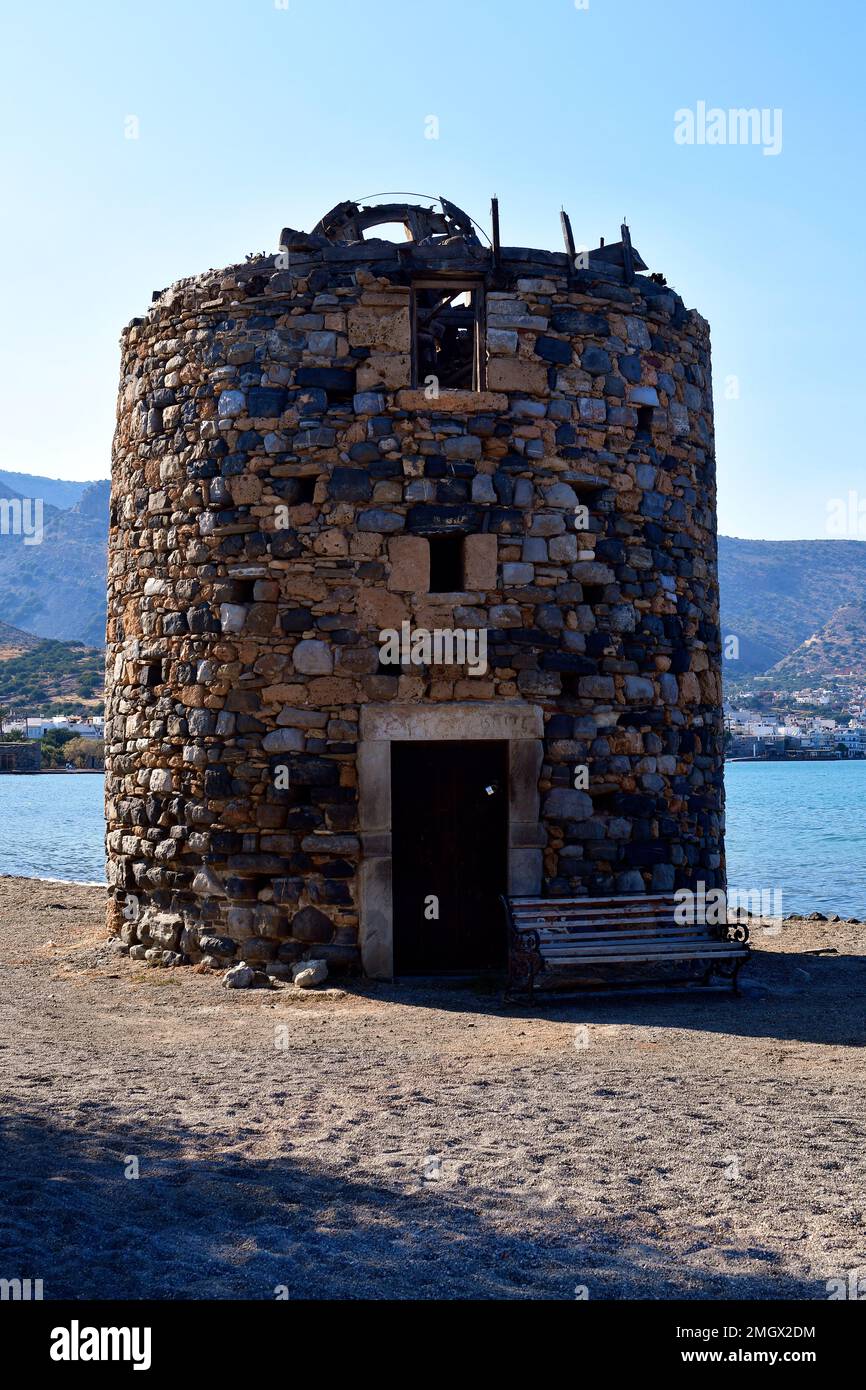 Greece, Crete, old windmills built of stone in Elounda on gulf of ...
