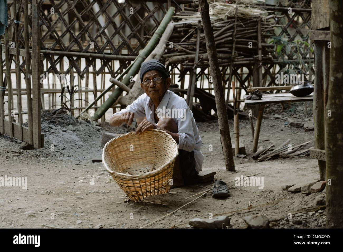 a tribe man making handicraft in his hill's yard Stock Photo - Alamy