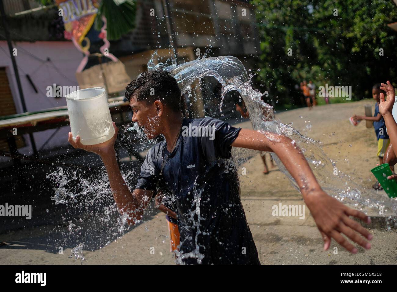 A boy is drenched with water as he celebrates Carnival in the streets ...