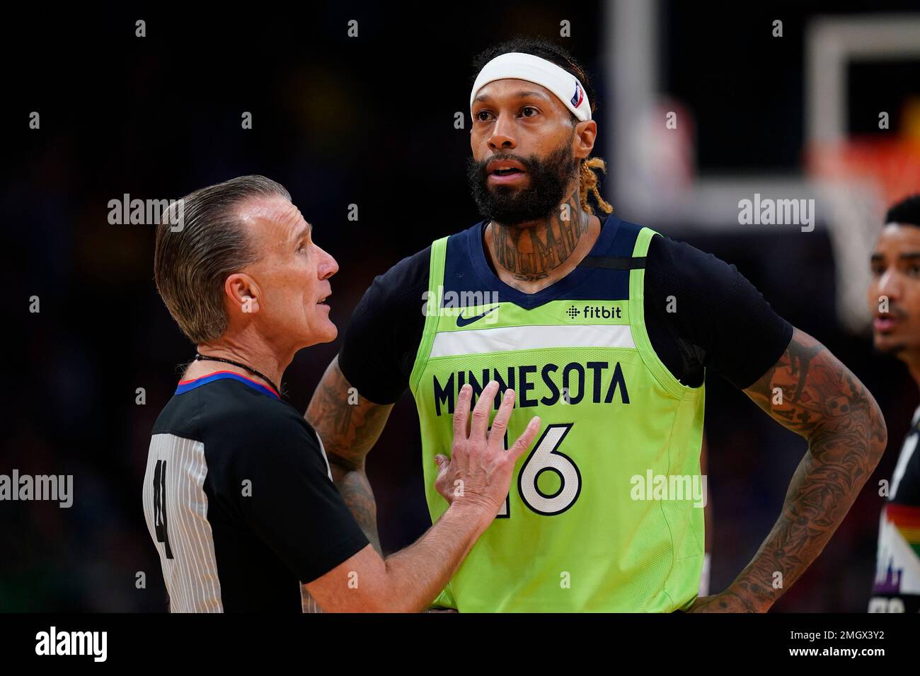 Referee Ken Mauer (41) talks with Minnesota Timberwolves forward James ...