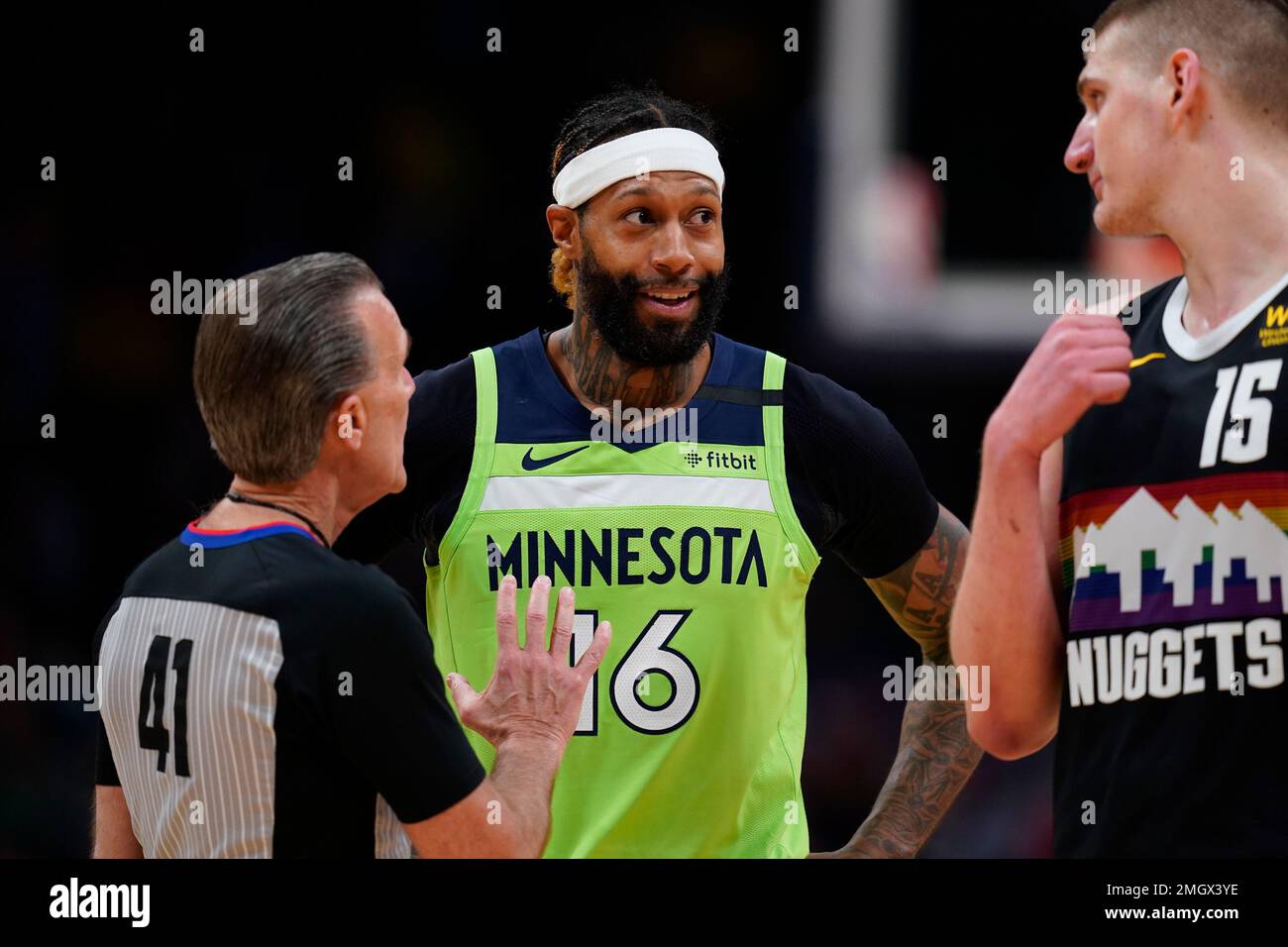 Referee Ken Mauer (41) talks with Minnesota Timberwolves forward James ...