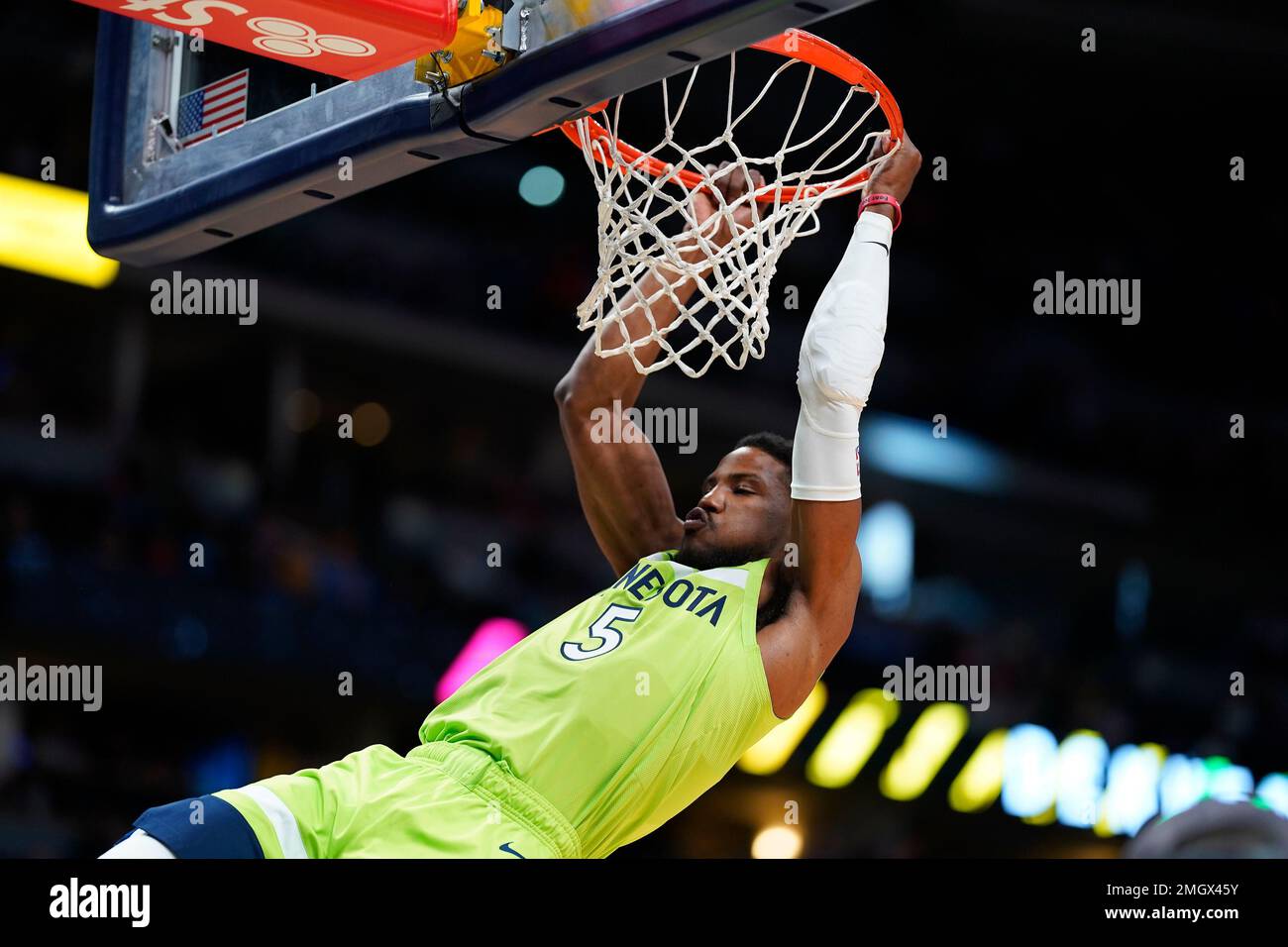Minnesota Timberwolves guard Malik Beasley hangs on the rim during an ...