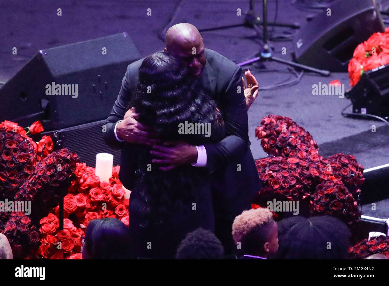 Former Los Angeles Lakers' Magic Johnson hugs Pam Bryant mother of Kobe ...