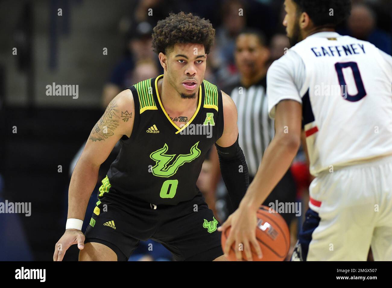 South Florida's David Collins (0) guards Connecticut's Jalen Gaffney (0 ...