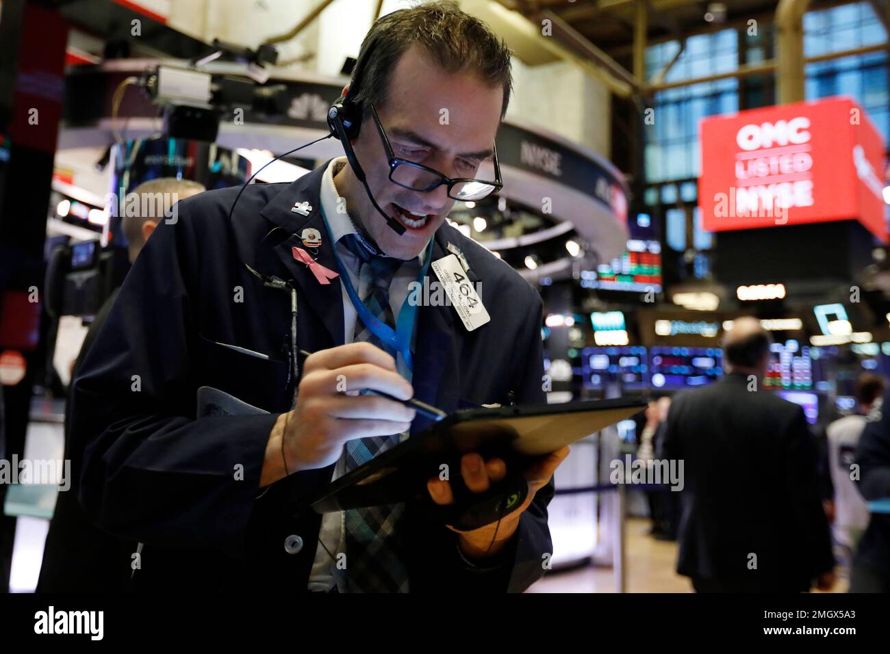 Trader Gregory Rowe works on the floor of the New York Stock Exchange, Monday, Feb. 24, 2020 ...
