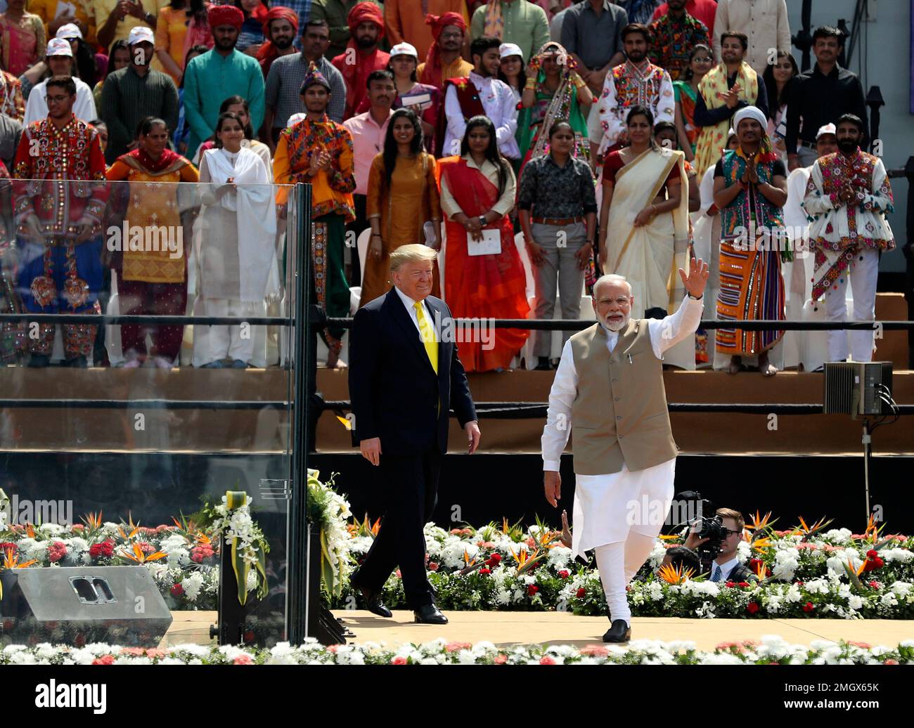 Indian Prime Minister Narendra Modi, right, waves to the crowd after he ...