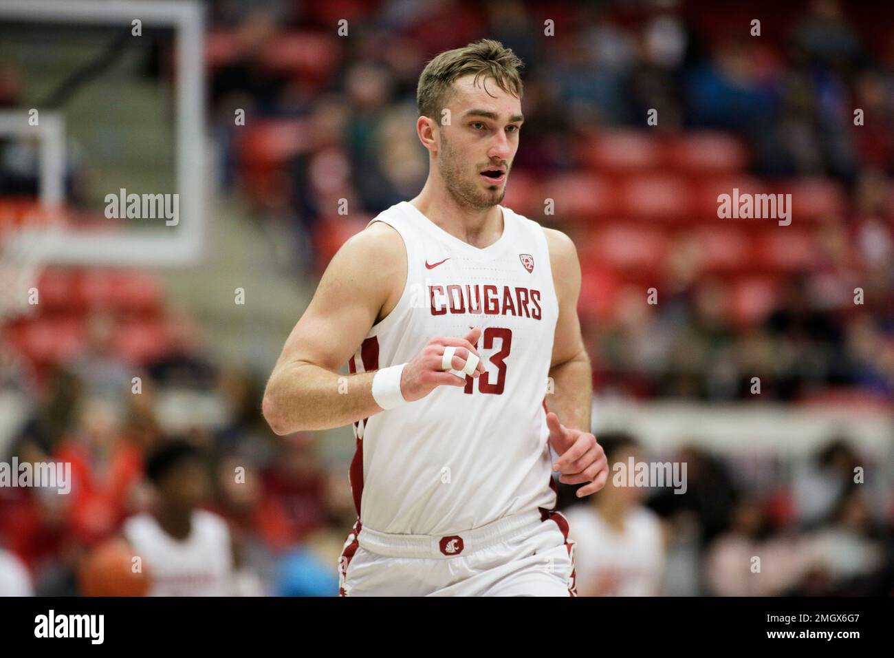 Washington State forward Jeff Pollard (13) runs on the court during the ...