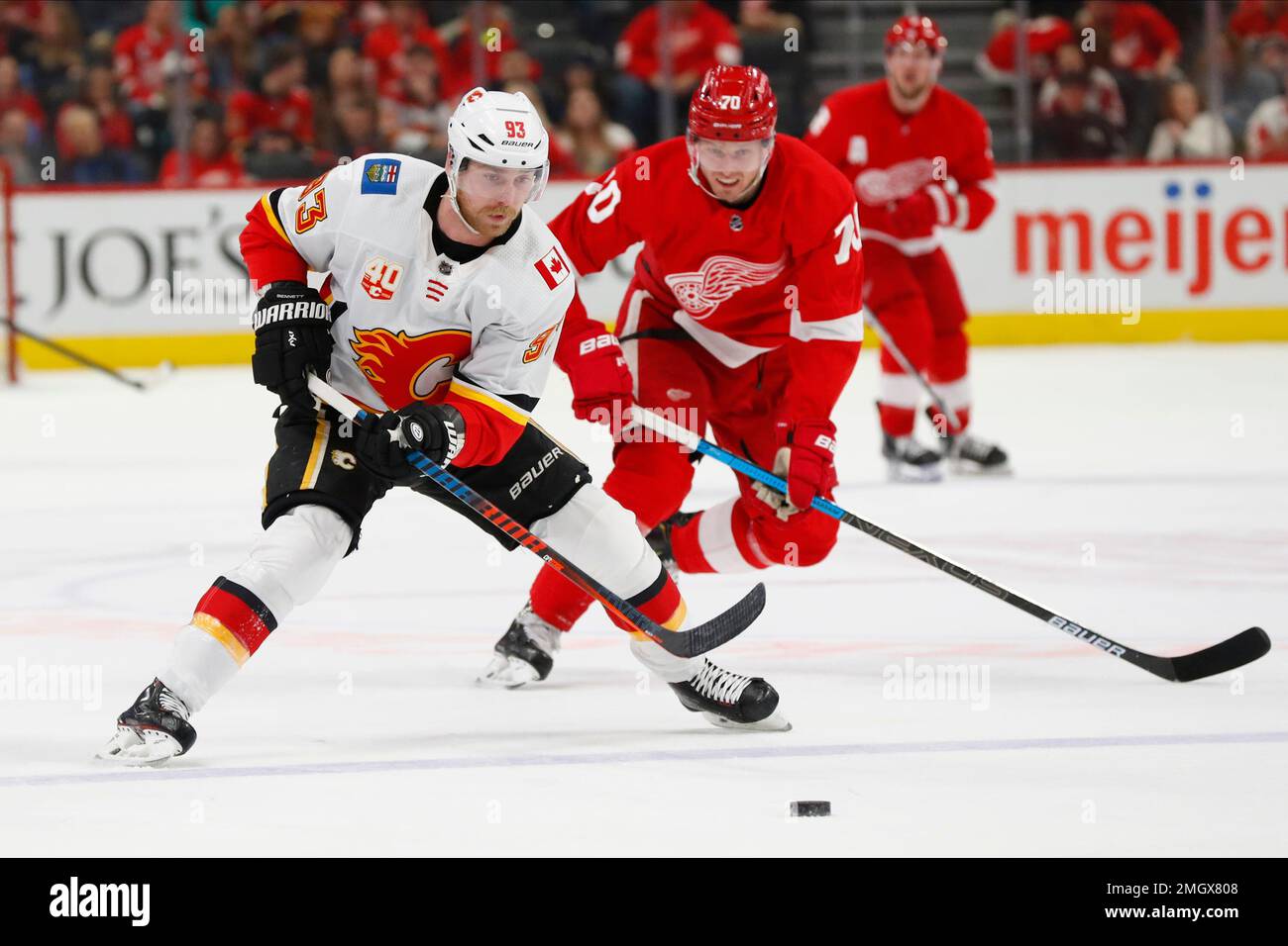 Calgary Flames center Sam Bennett (93) collects the puck against the ...