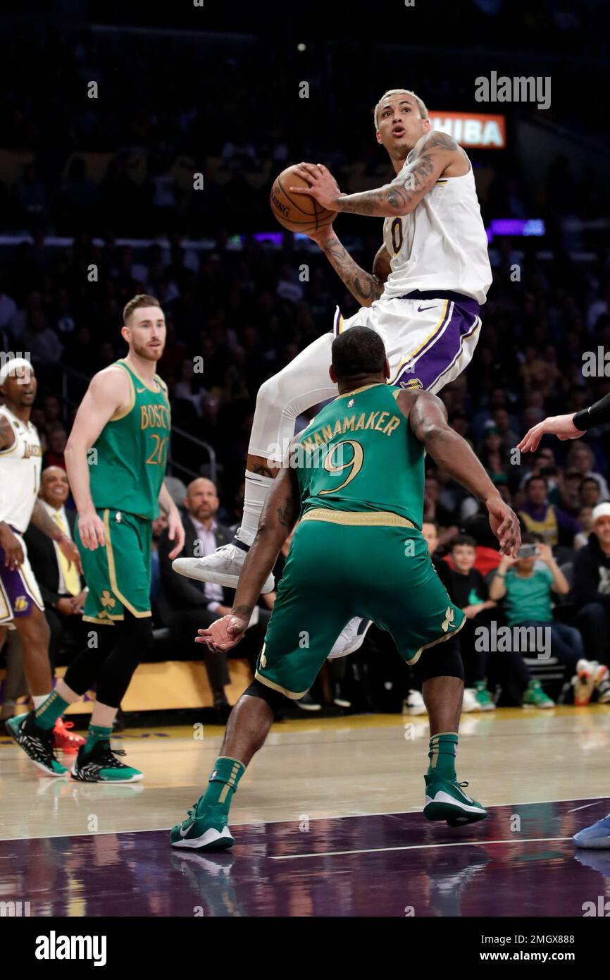Los Angeles Lakers' Kyle Kuzma (0) shoots over Boston Celtics' Brad ...
