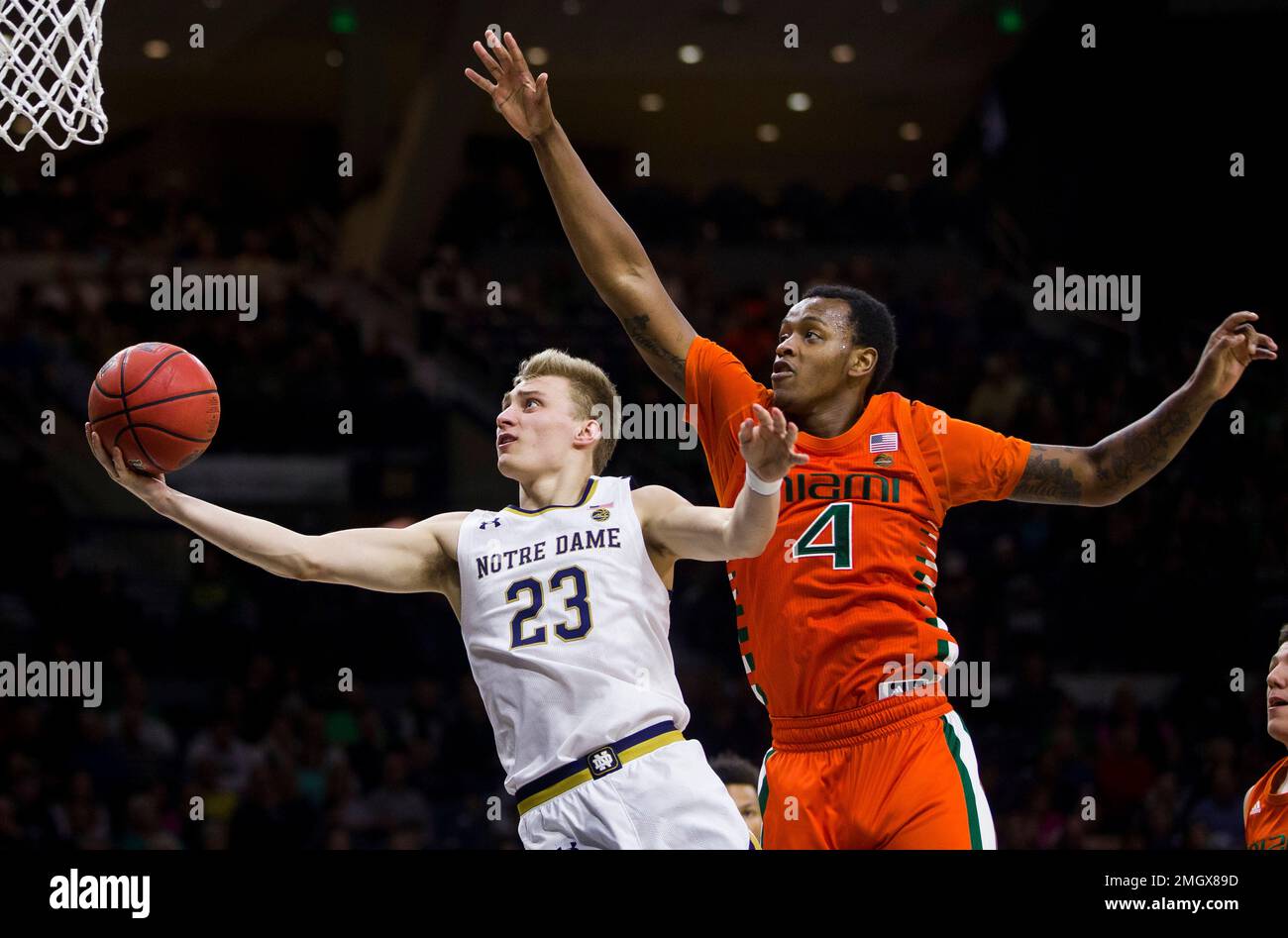 Notre Dame's Dane Goodwin (23) goes in for a layup over Miami's Keith ...