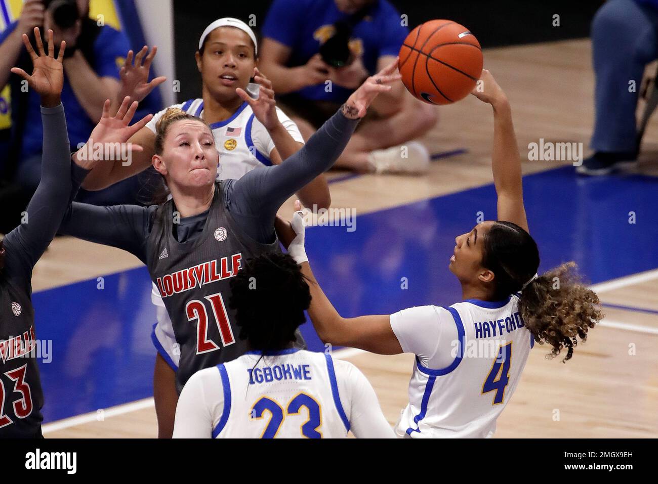 Louisville's Kylee Shook (21) blocks a shot attempt by Pittsburgh's Emy ...