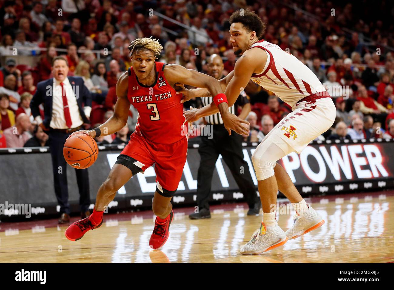Texas Tech guard Jahmi'us Ramsey (3) drives past Iowa State forward ...