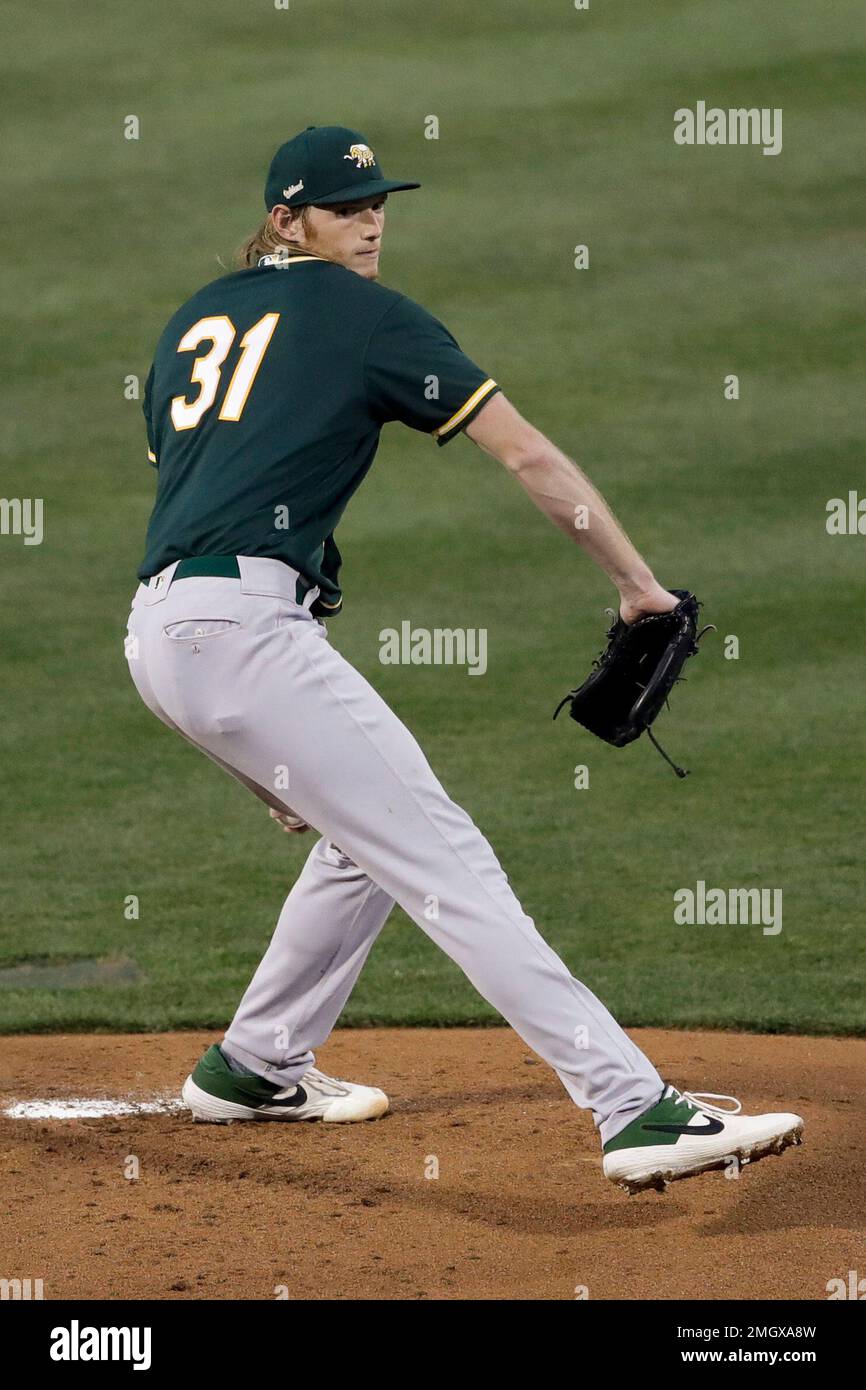 Oakland Athletics starting pitcher A.J. Puk pitches to a Chicago Cubs ...