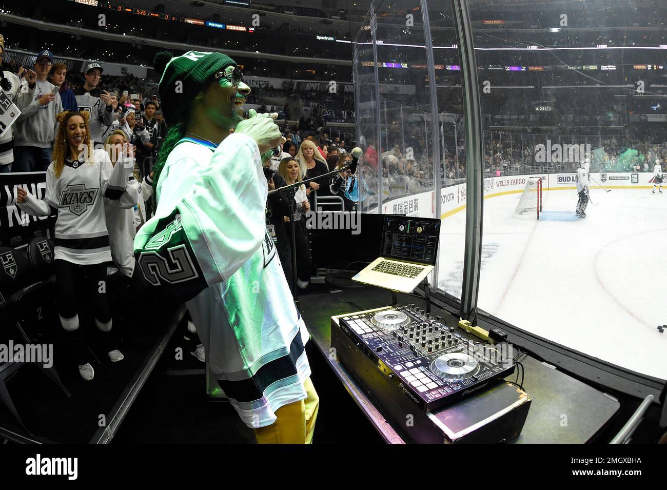 Rapper Snoop Dogg DJs prior to an NHL hockey game between the Los ...