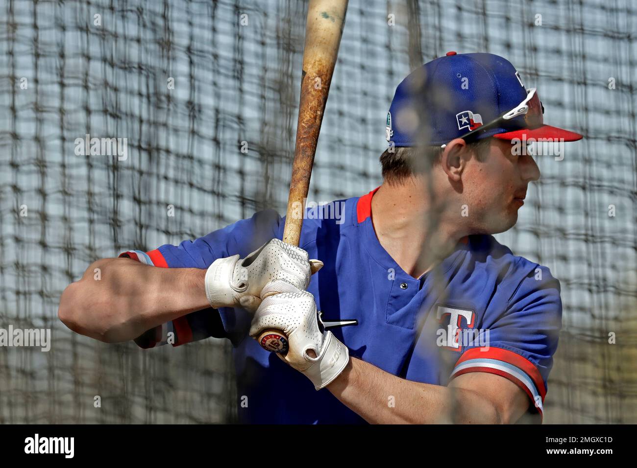 Texas Rangers' Nick Solak bats during spring training baseball practice ...