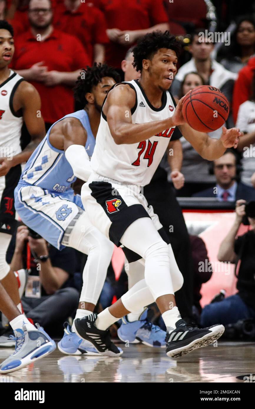 Louisville forward Dwayne Sutton (24) passes the ball off during the ...