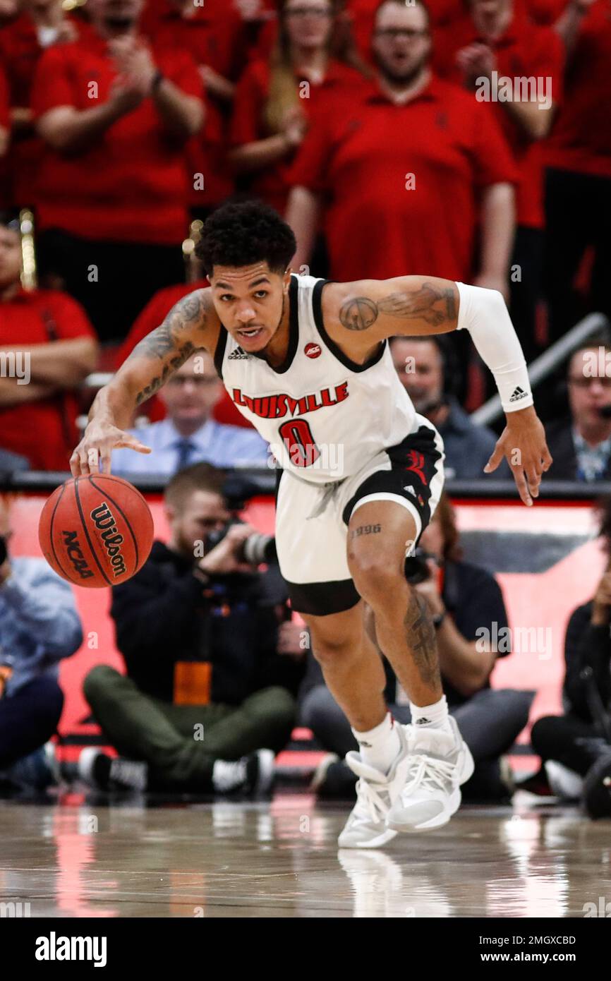 Louisville guard Lamarr Kimble (0) drives the ball up court during the ...