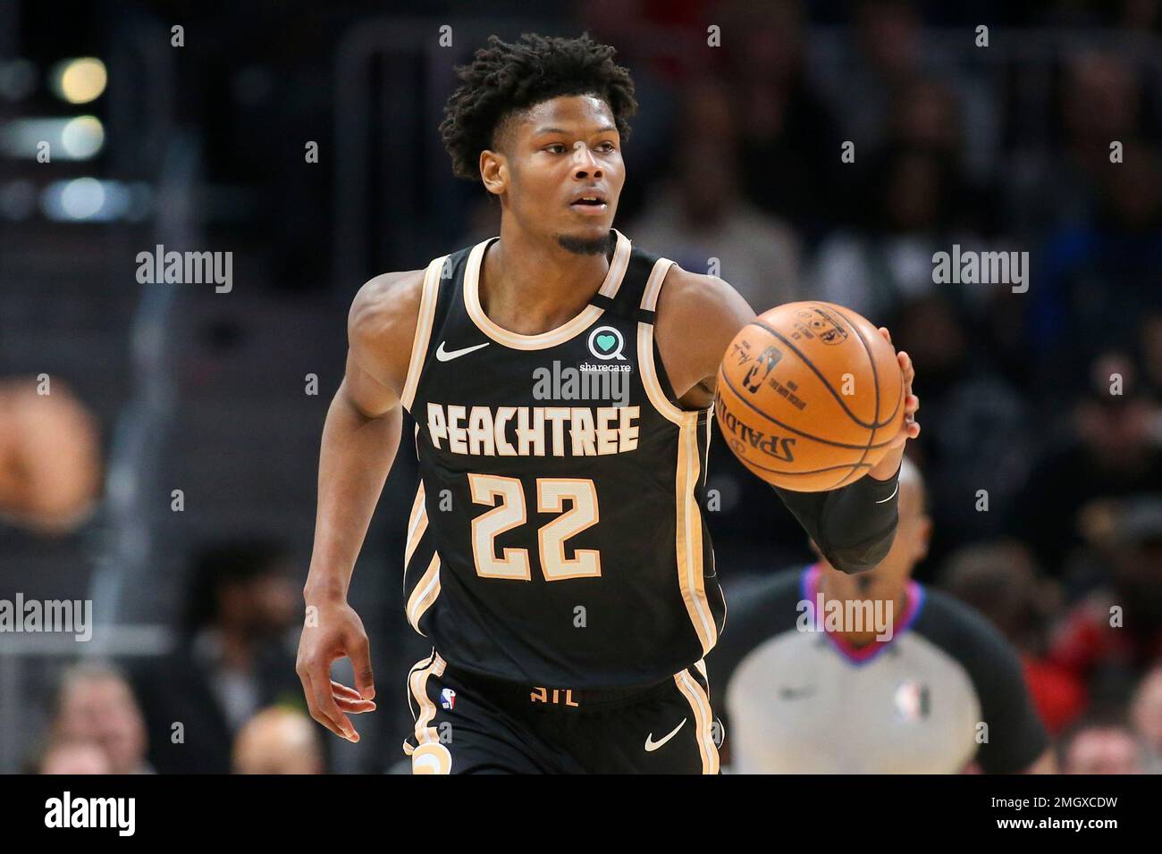 Atlanta Hawks guard Cam Reddish (22) dribbles in the first half of an ...