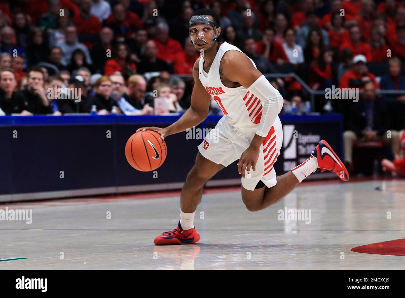 Dayton's Rodney Chatman (0) controls the ball in the first half of an ...