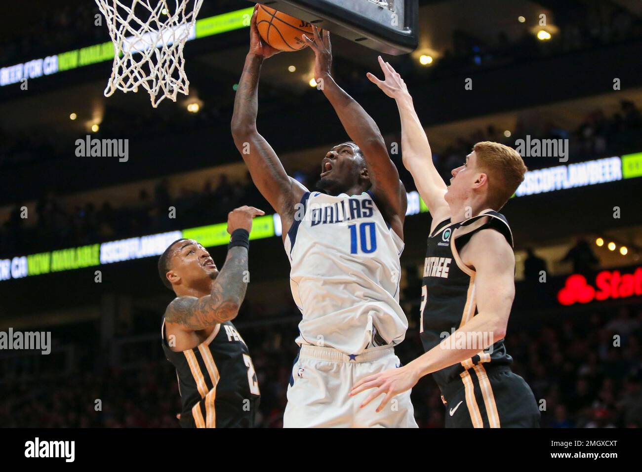 Dallas Mavericks forward Dorian Finney-Smith (10) shoots past Atlanta ...